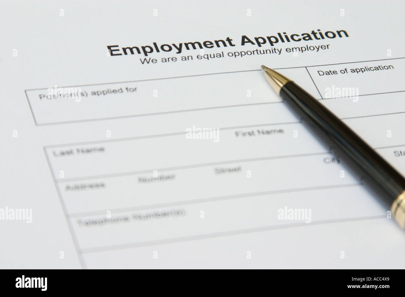 pen on top of employment application form Stock Photo - Alamy