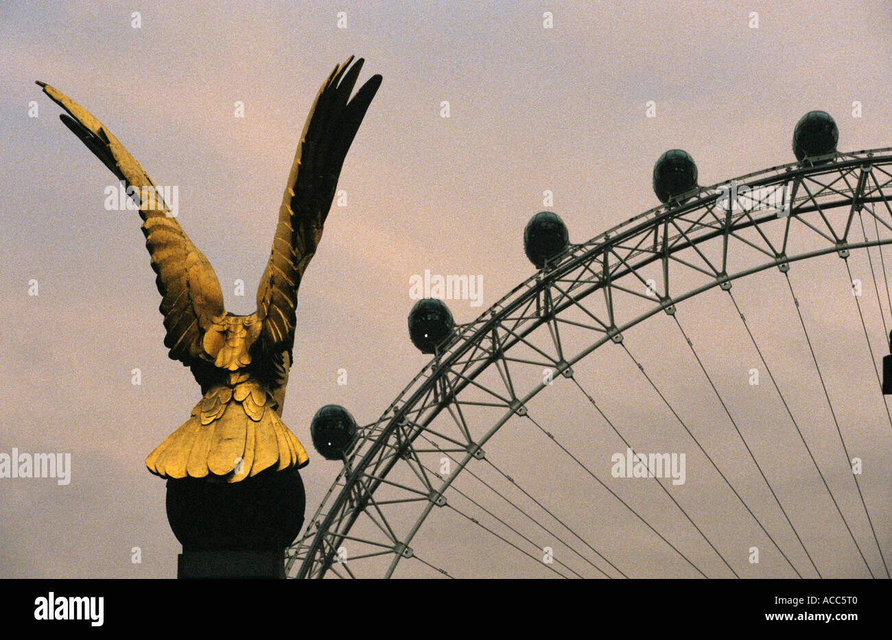Eagle statue, famous landmark London Eye in background, London, UK ...