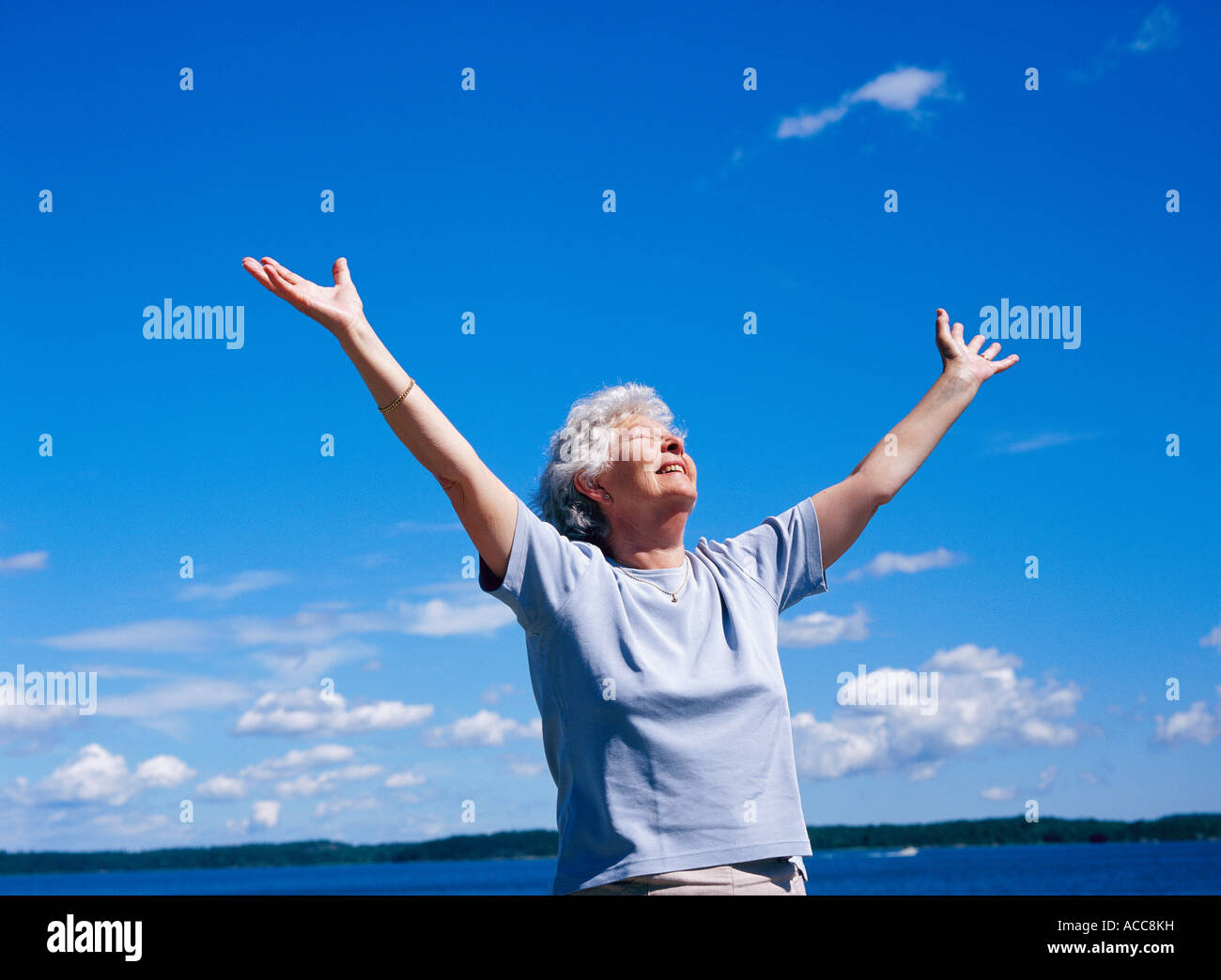 A woman with her arms stretched out Stock Photo - Alamy