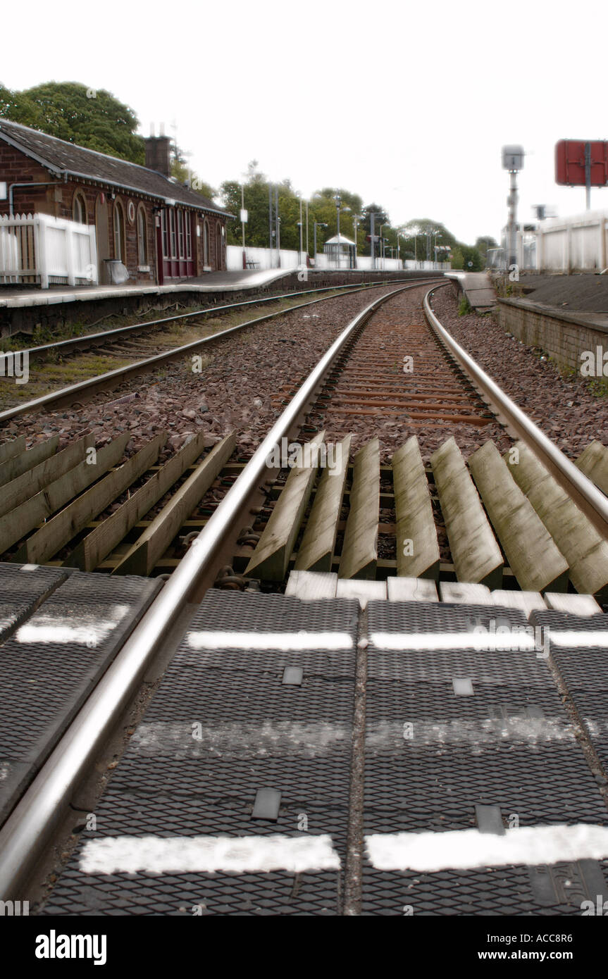 Railway track at level crossing Stock Photo - Alamy