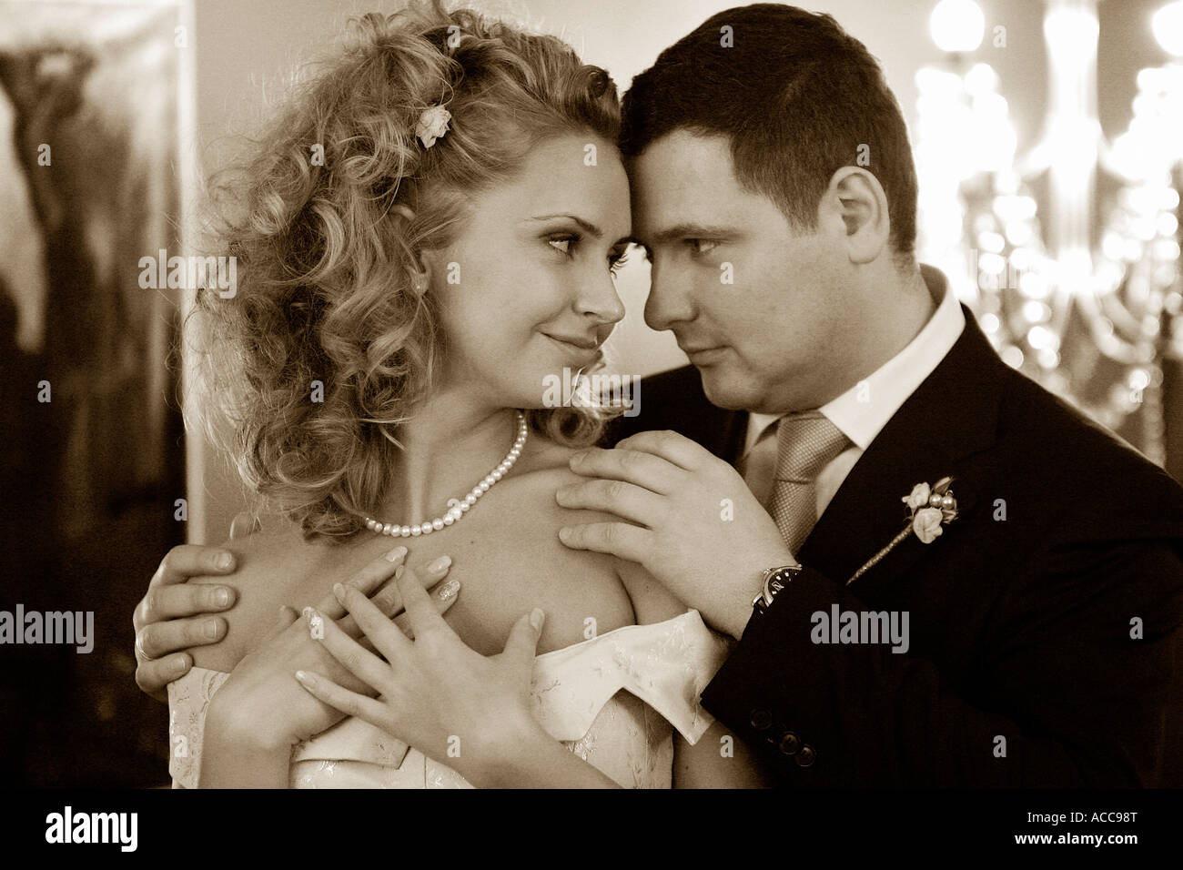 Newly Married Couple having a cuddle Stock Photo - Alamy