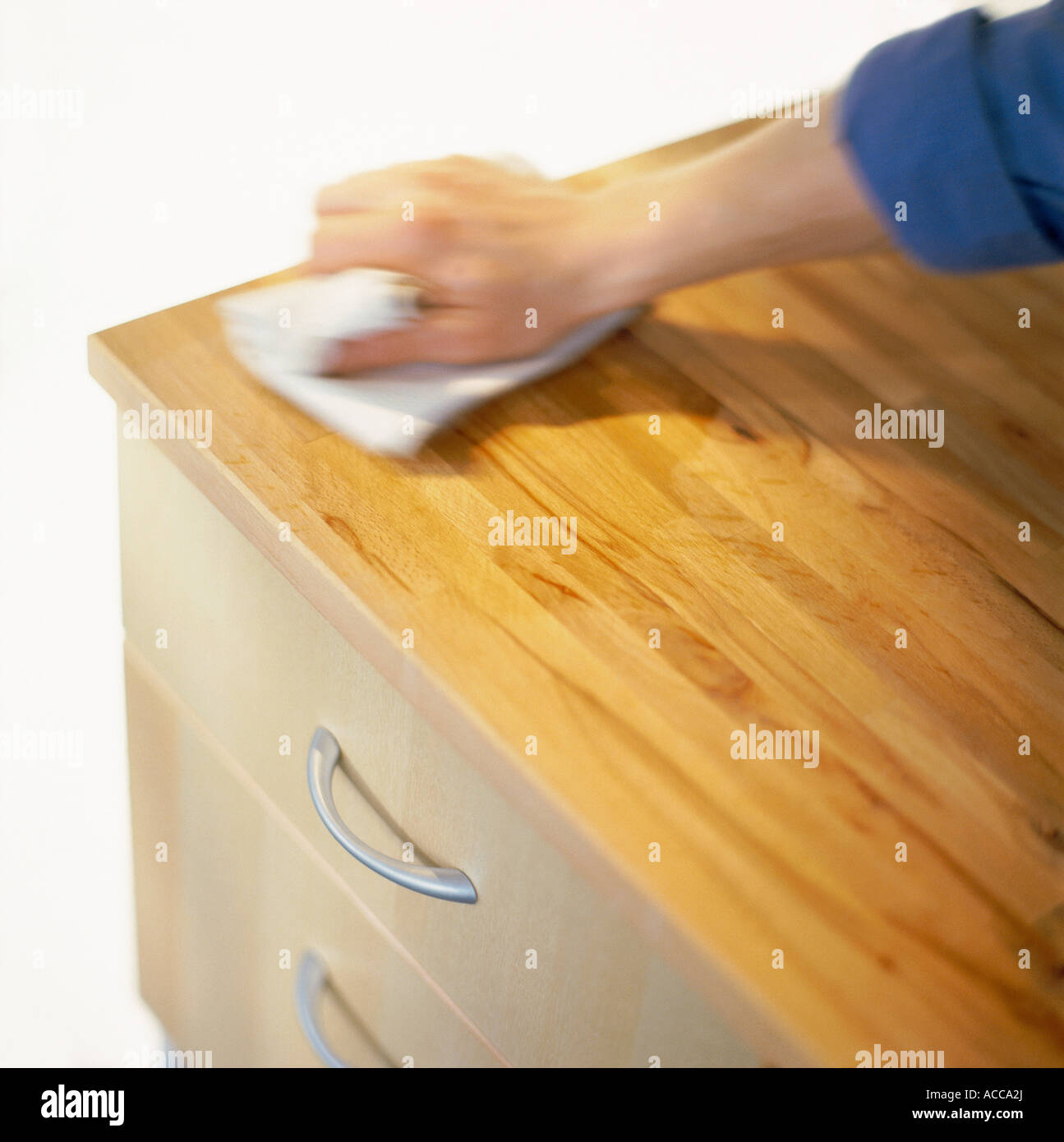 A hand cleaning a cupboard Stock Photo - Alamy