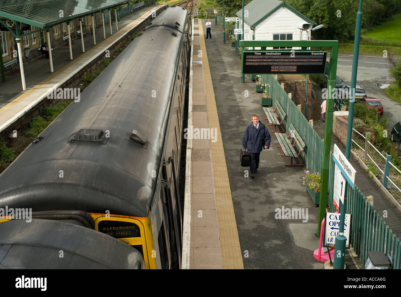 Machynlleth Powys railway station single man walking along platform ...