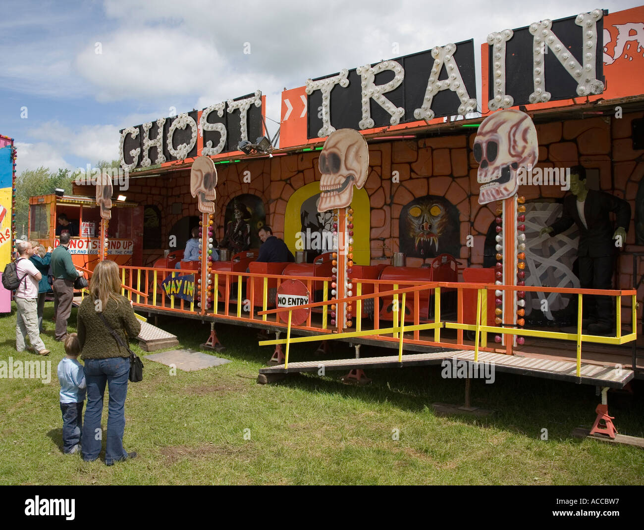 Adult and child looking at a ghost train fairground ride Abergavenny ...
