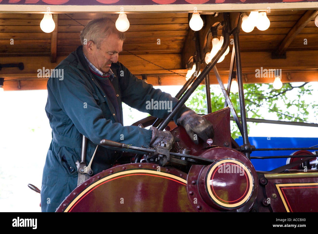 Man working on traction engines on display at steam fair Wales UK Stock ...