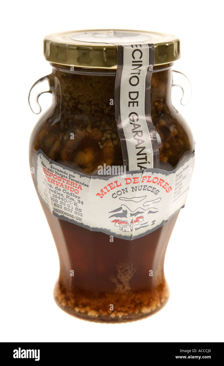 Imported Spanish honey with walnuts in shaped glass jar Stock Photo - Alamy