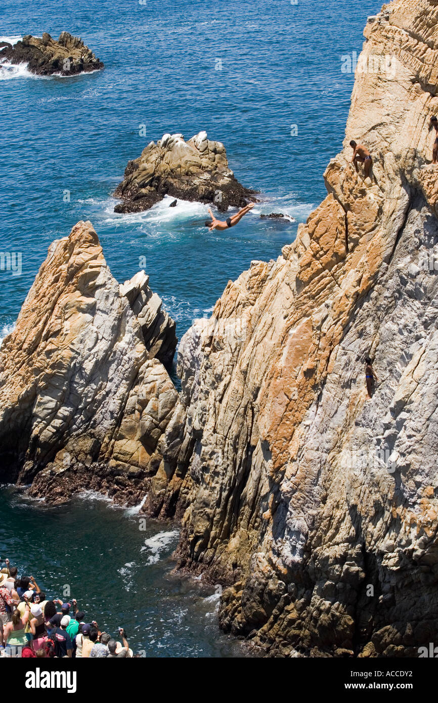Cliff diving in Acapulco Mexico with diver in air Stock Photo - Alamy