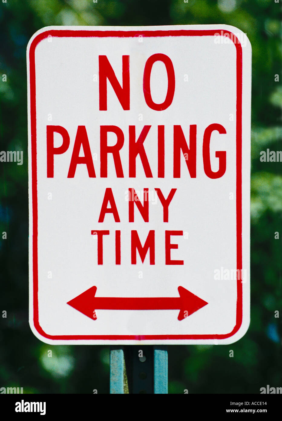 White and red no parking any time sign Stock Photo - Alamy