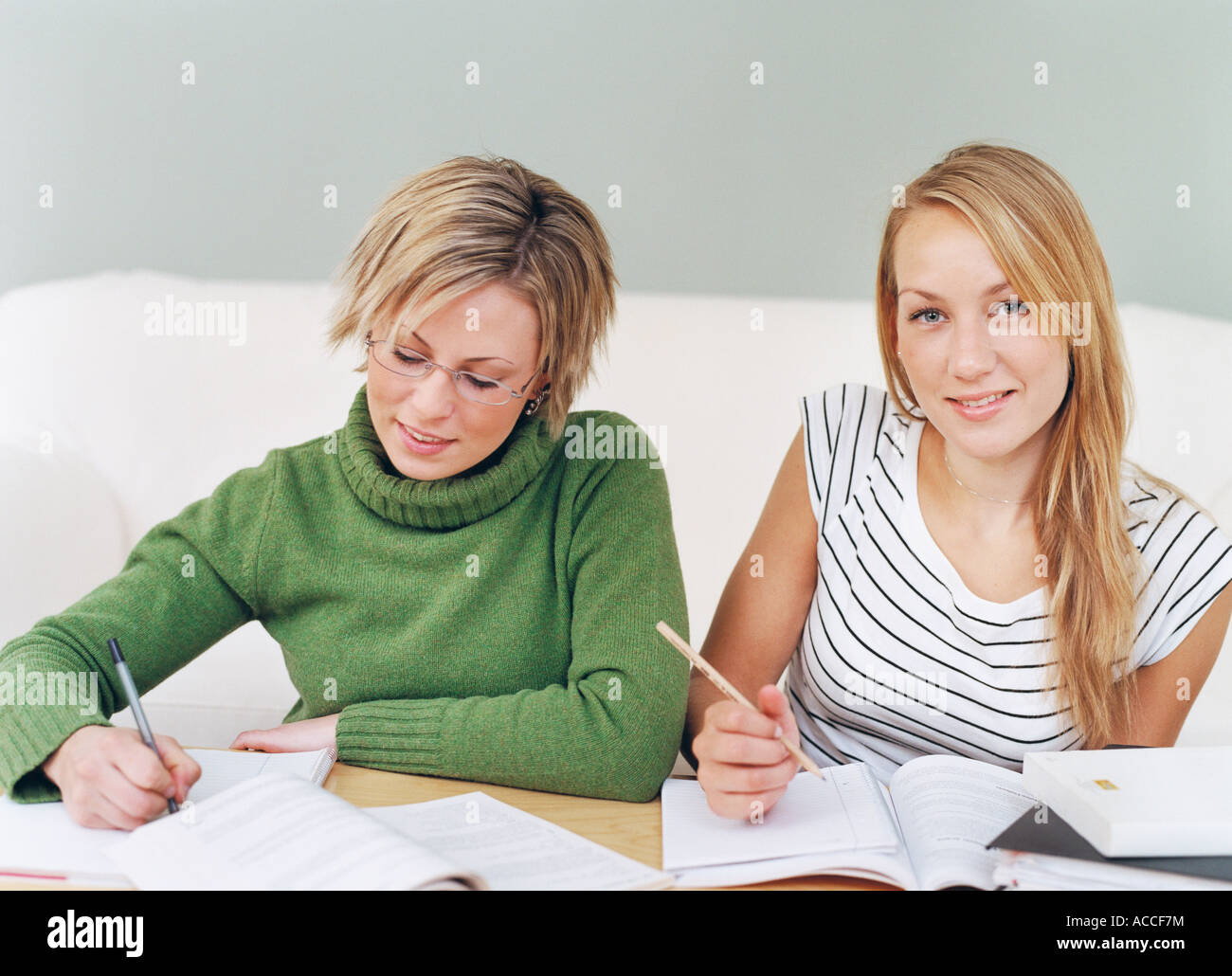 Two women studying Stock Photo - Alamy