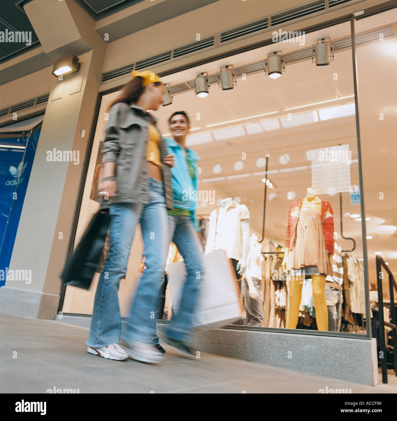 Two women shopping Stock Photo - Alamy