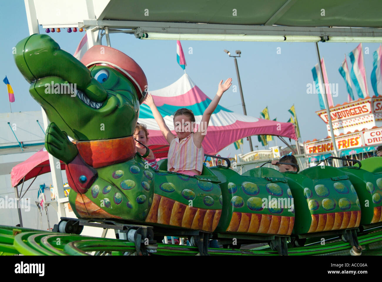 Children enjoy thrilling rides at a carnival Stock Photo - Alamy
