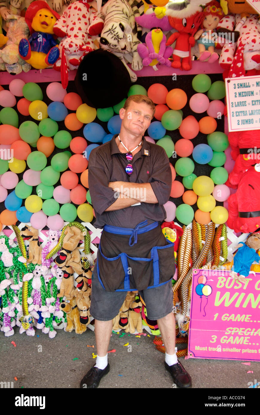 Carnival game vendor Stock Photo - Alamy