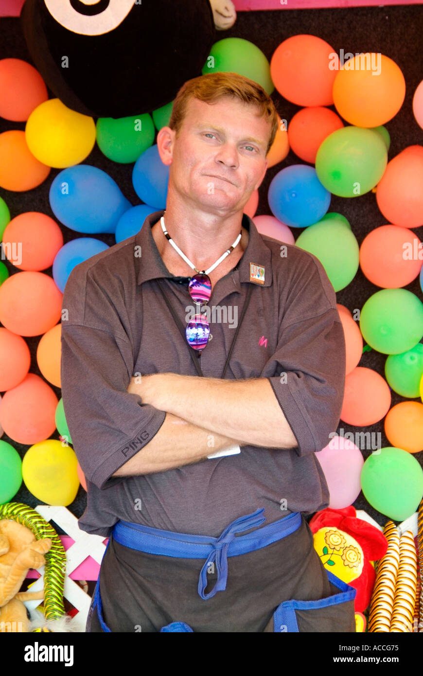 Carnival game vendor Stock Photo - Alamy