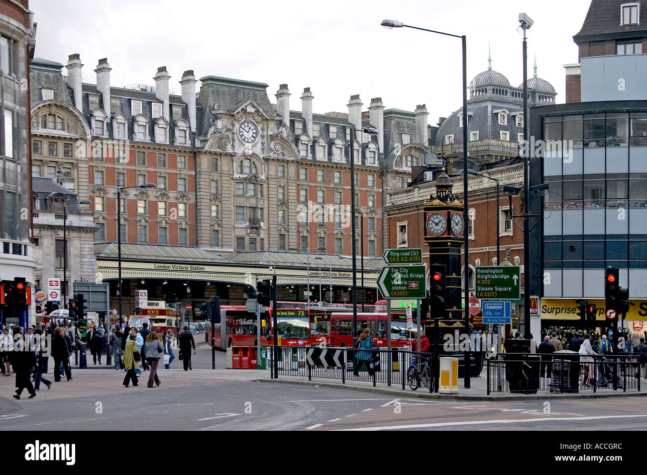 London Victoria Railway Station exterior with roadsigns and buses ...