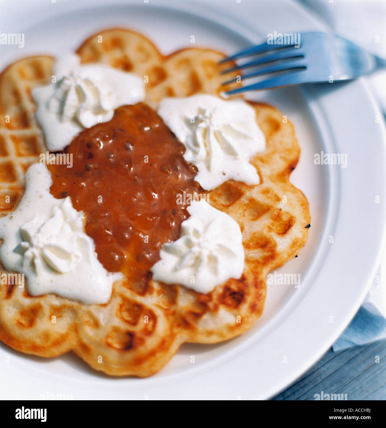 Jam and whipped cream on a waffle Stock Photo - Alamy