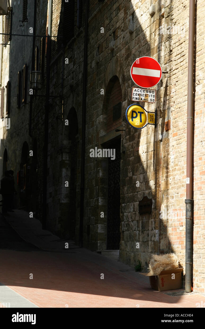 Street signs in alley way Stock Photo - Alamy