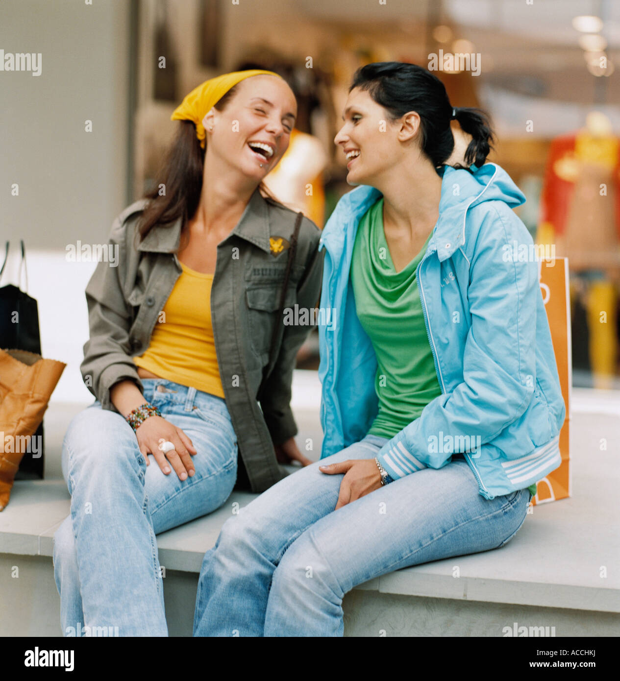 Two women laughing Stock Photo - Alamy