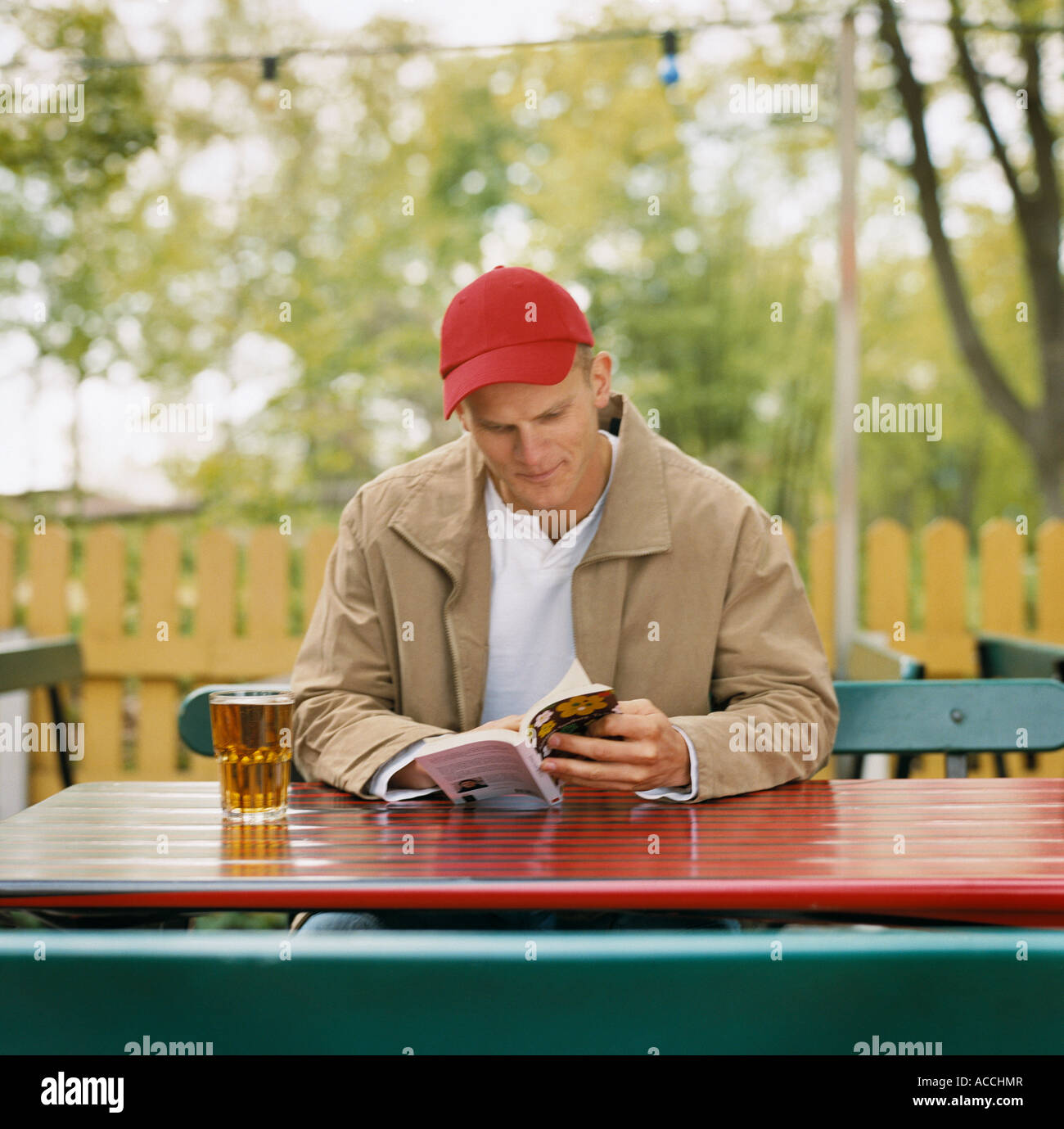 A man reading a book Stock Photo - Alamy