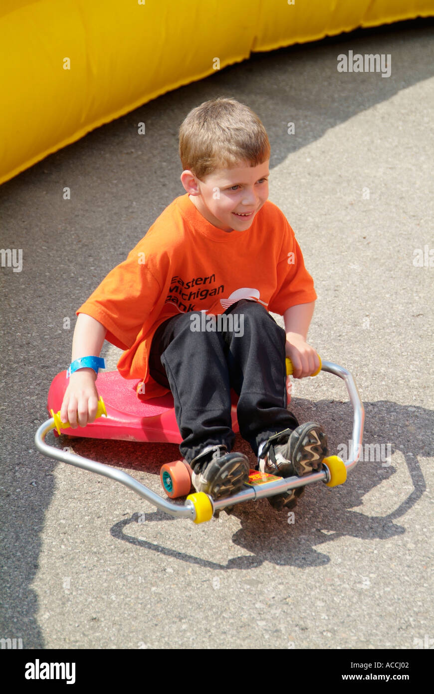 Boy toddler rides on safe roller vehicle platform Stock Photo - Alamy