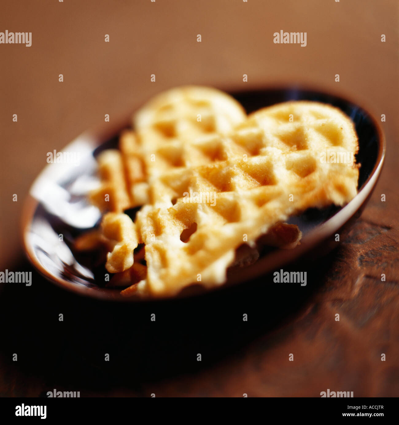 A heart shaped waffle on a plate close-up Stock Photo - Alamy