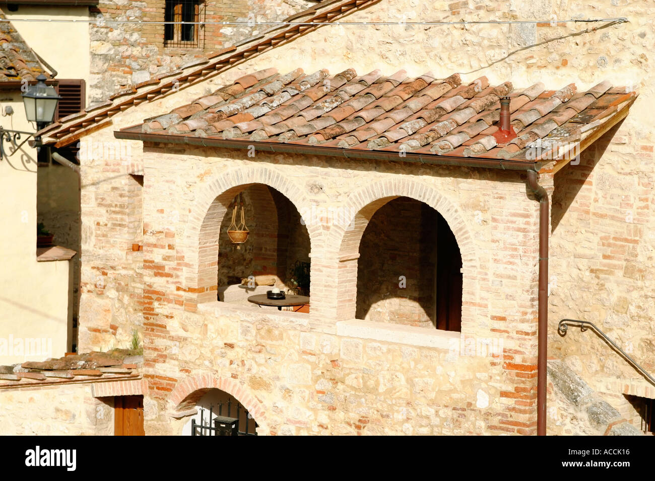Porch on brick house in Italy Stock Photo - Alamy