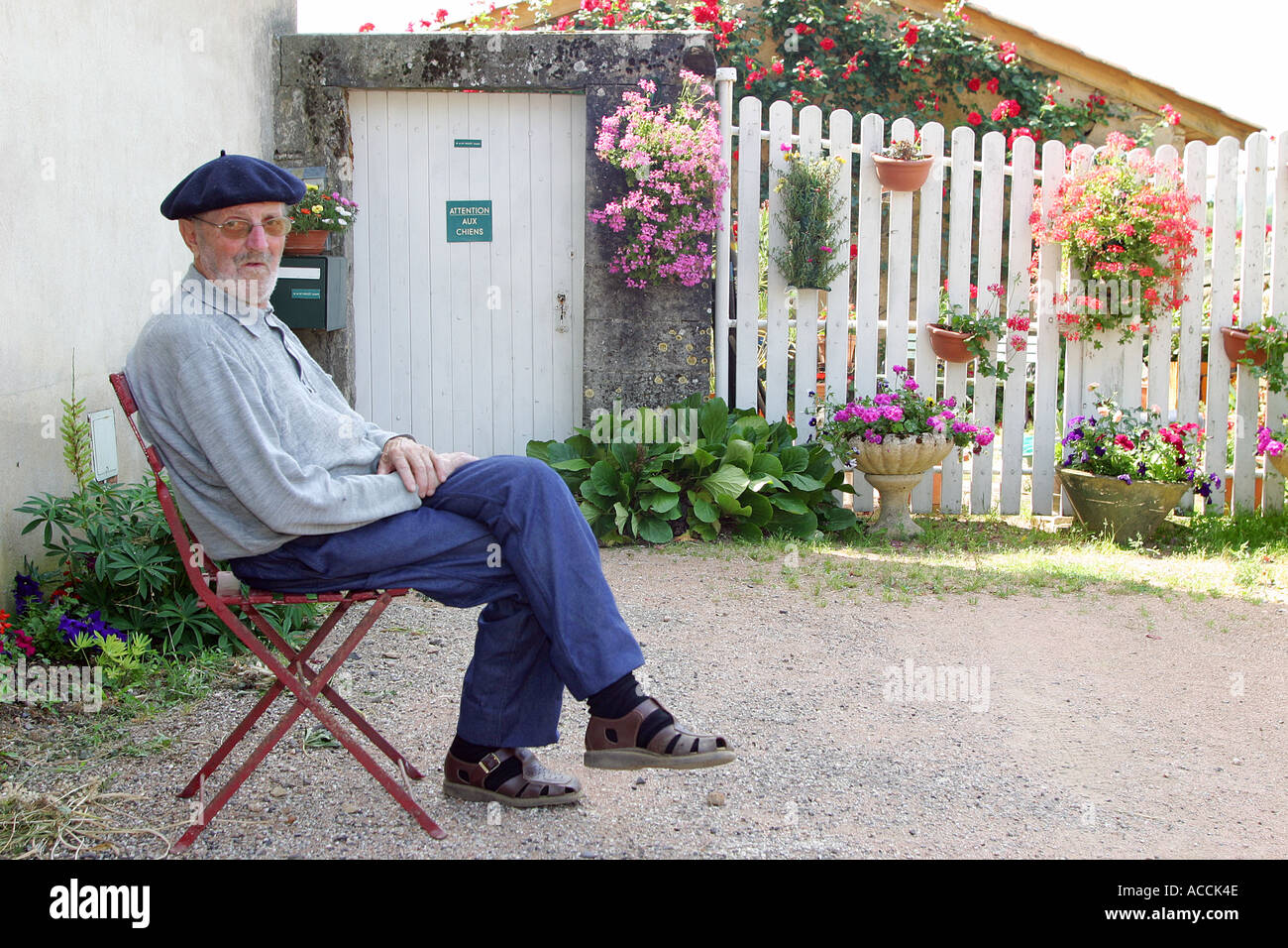 French berret wearing old man in the small village of St point in ...