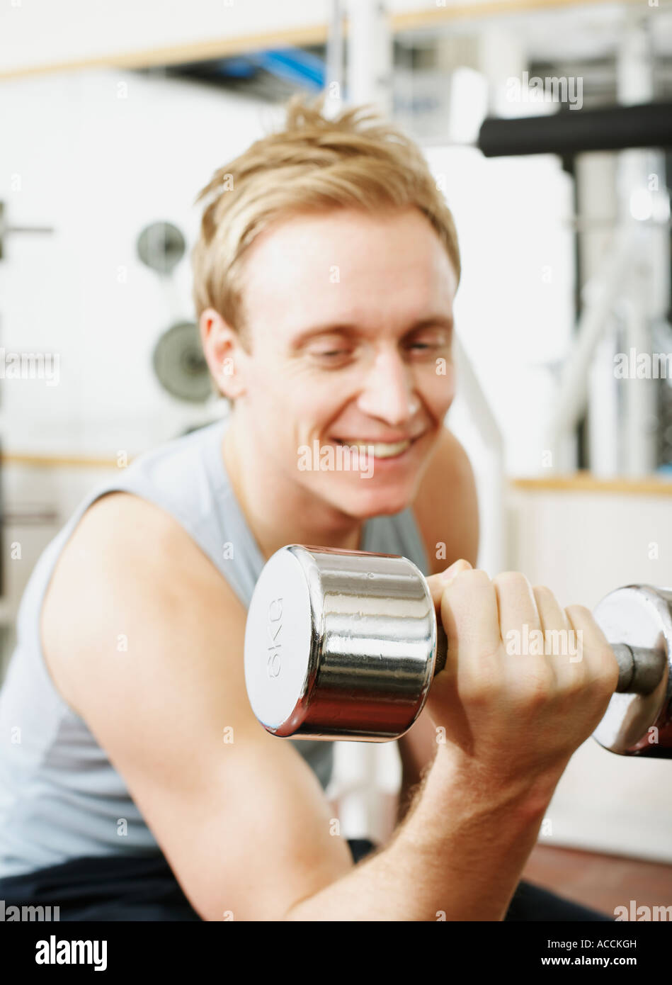 A man working out in a gym Stock Photo - Alamy