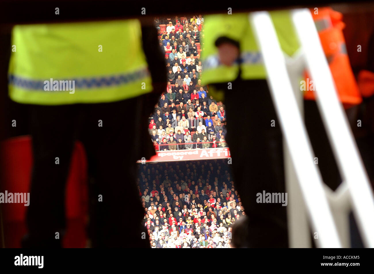 police officers at a football match watching the crowds of football ...