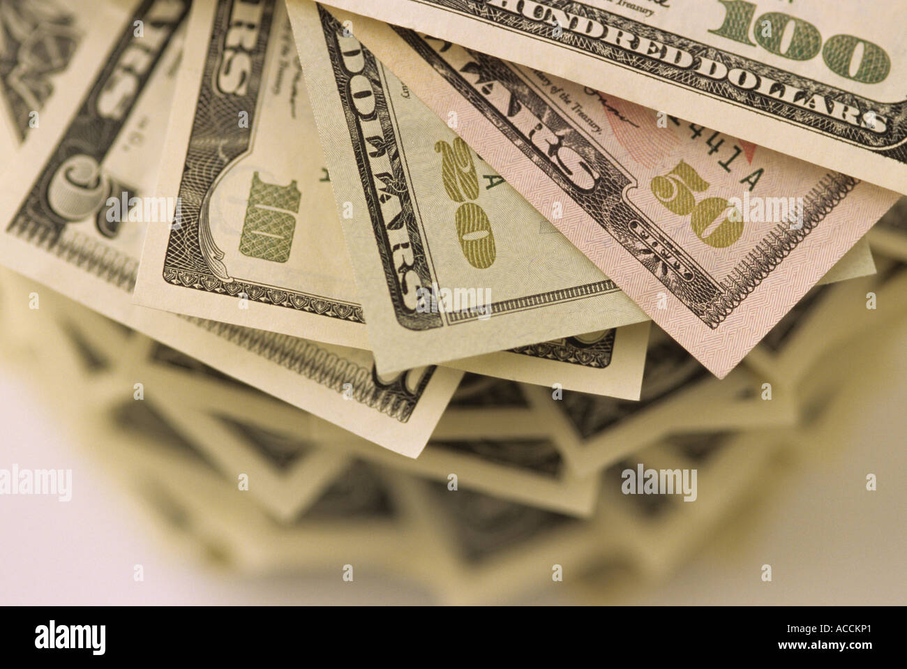Assortment of different money denominations stacked Stock Photo - Alamy