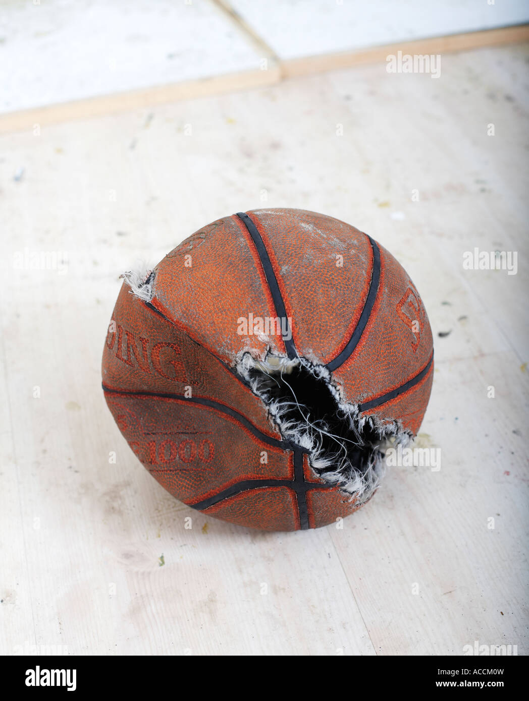 A torn basketball Stock Photo - Alamy