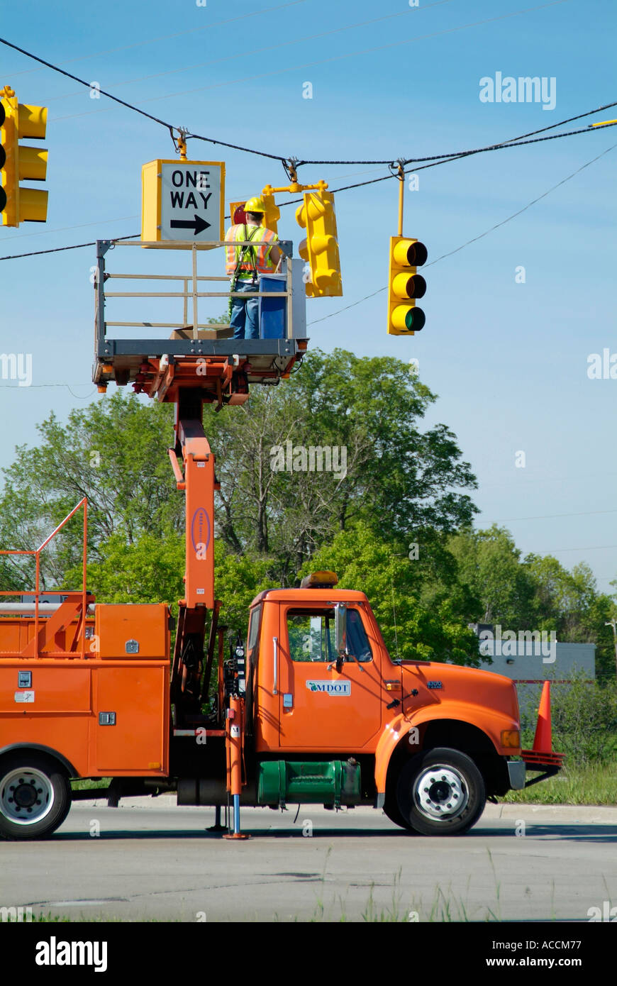 Maintenance crew works to restore fix and refurbish a street traffic ...