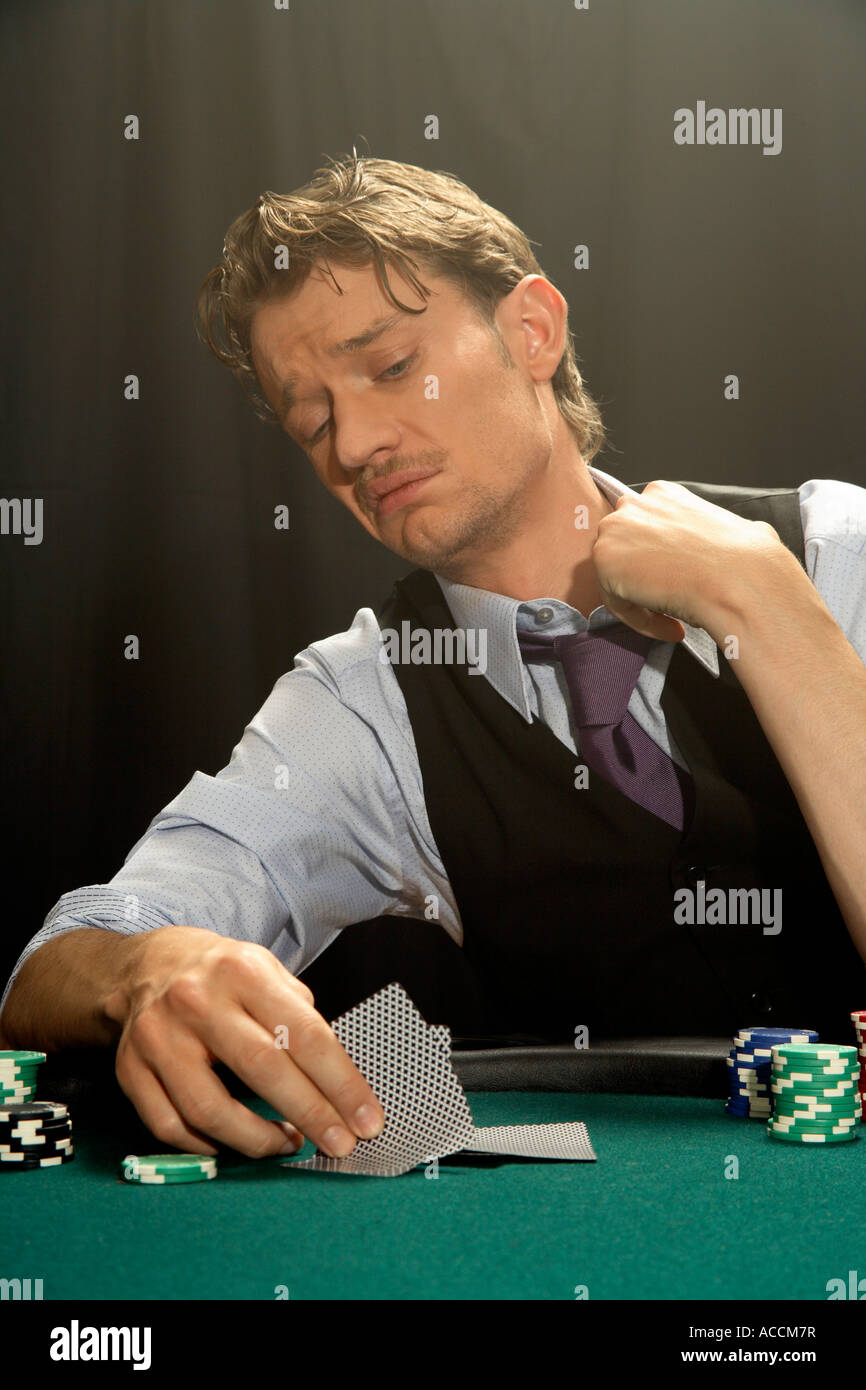 A man playing poker Stock Photo - Alamy