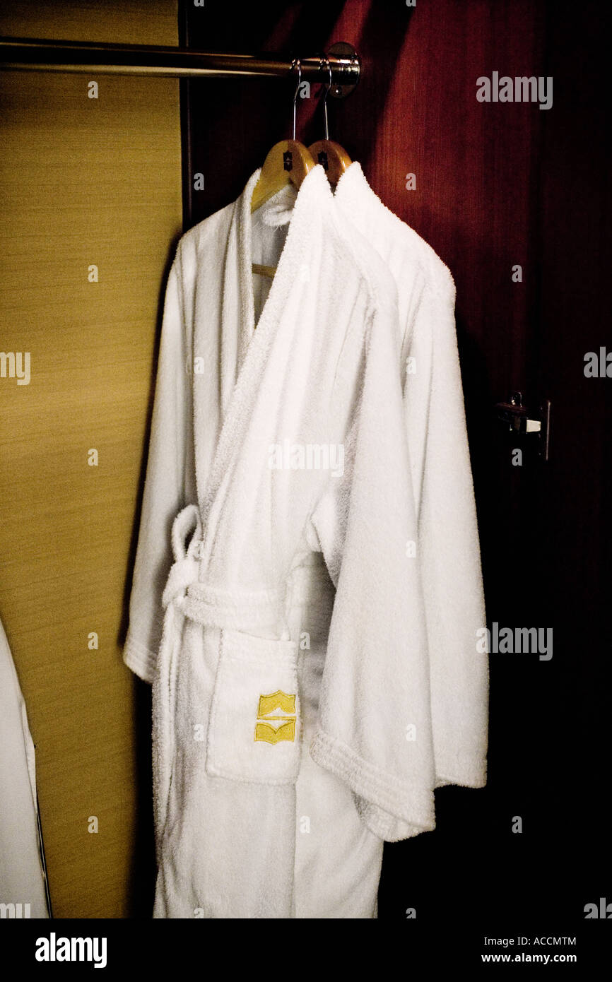 Dressing gowns in a closet Stock Photo - Alamy