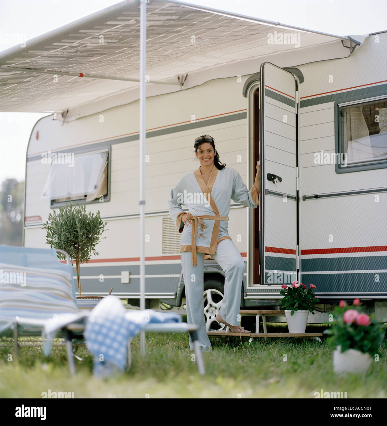 A woman in front of a trailer Stock Photo - Alamy