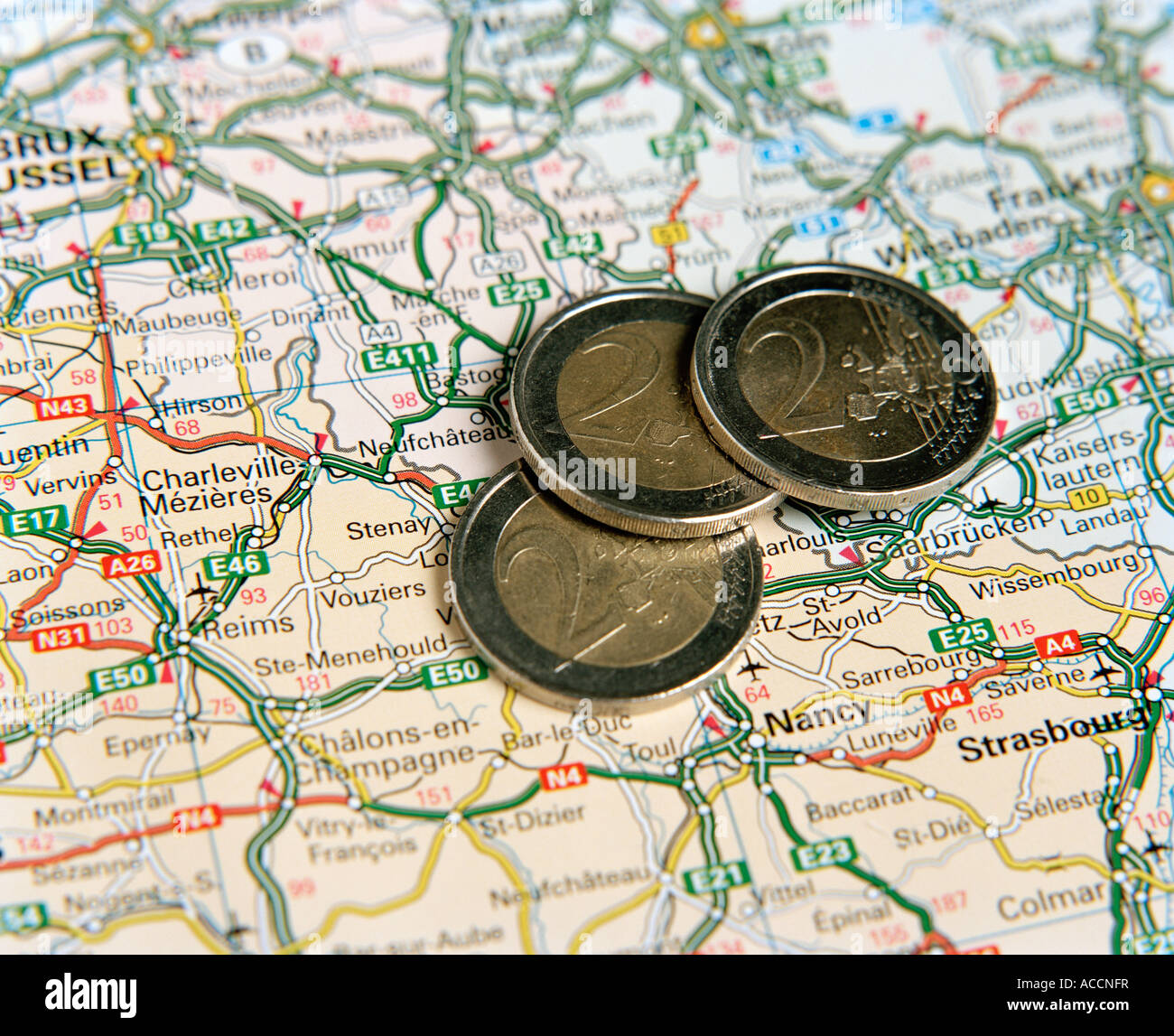 Coins on a map Stock Photo - Alamy