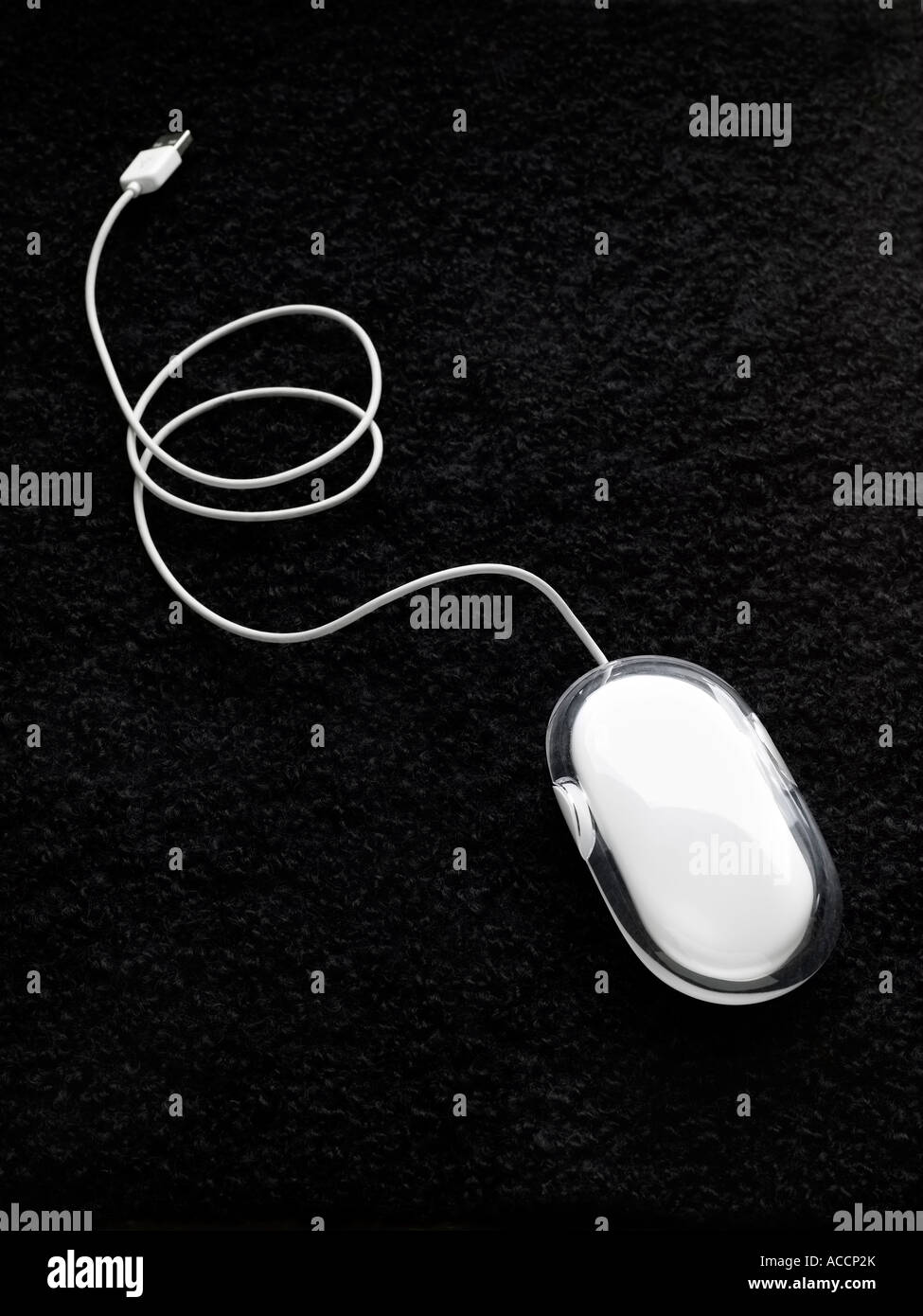 A computer mouse on a black background Stock Photo - Alamy