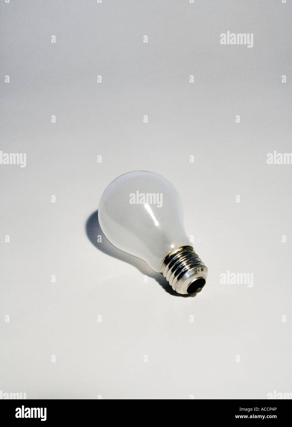 A light bulb on a grey background Stock Photo - Alamy