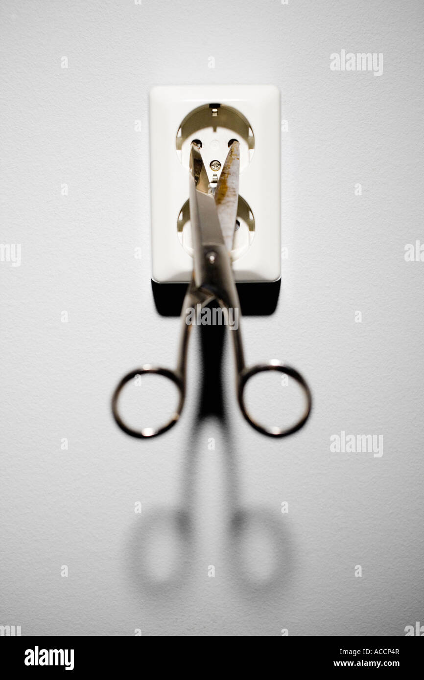 Scissors in a socket Stock Photo - Alamy