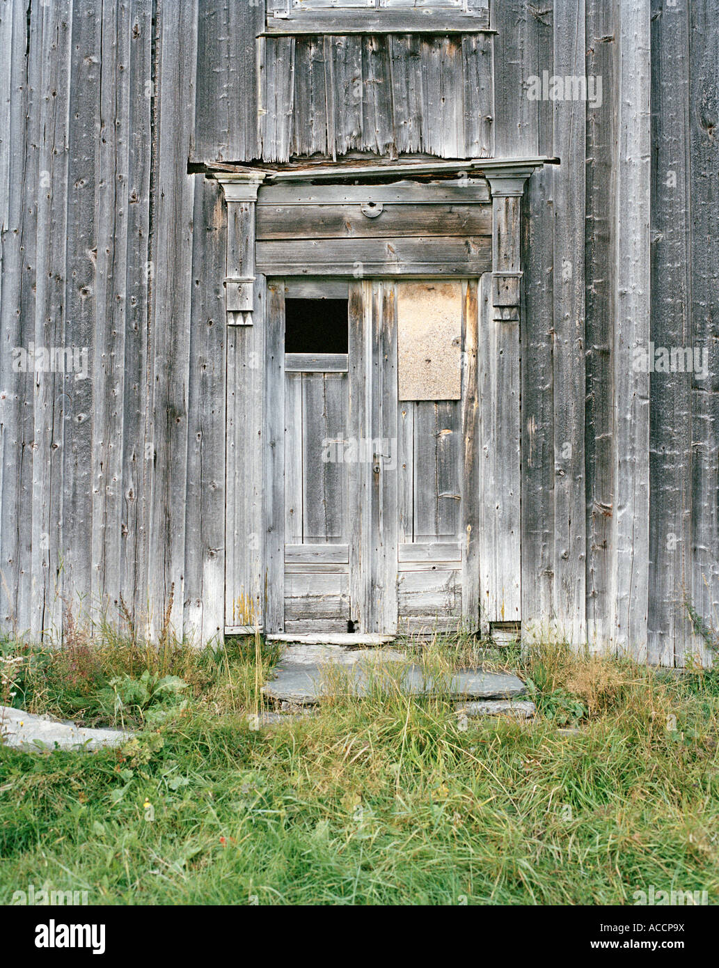 A worn door on a worn house Stock Photo - Alamy