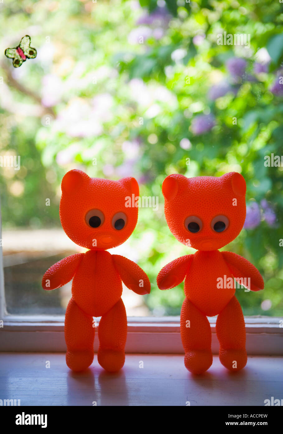 Two identical dolls in a window Stock Photo - Alamy