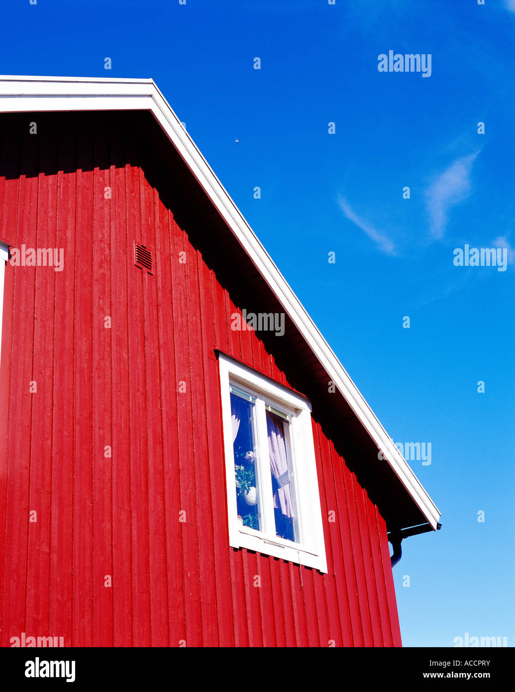 A window on a red house Stock Photo - Alamy