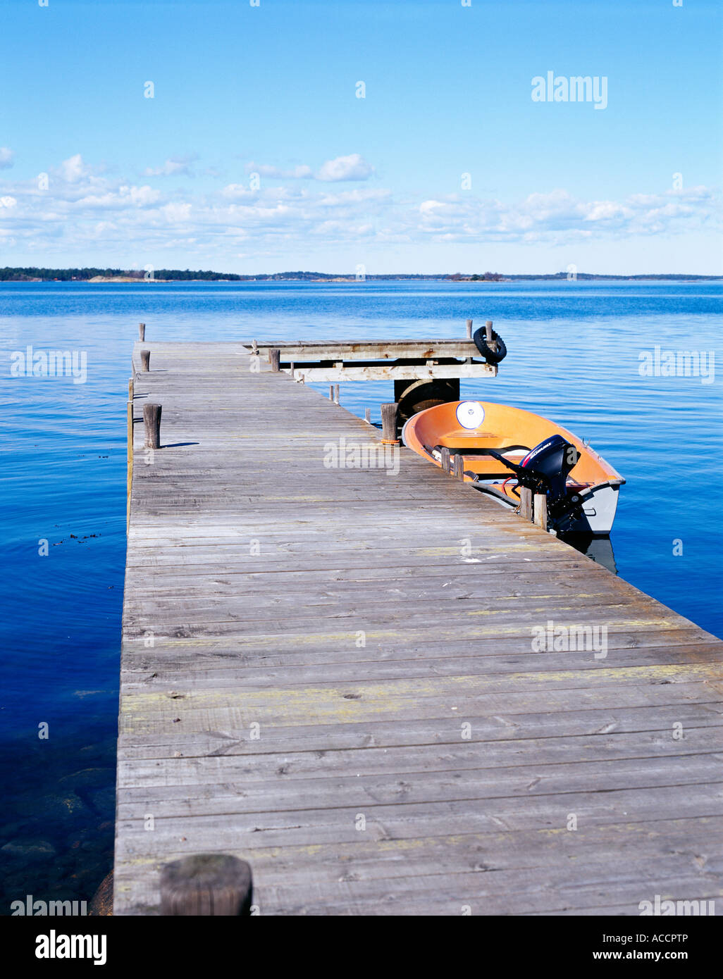 A boat by a boardwalk Stock Photo - Alamy