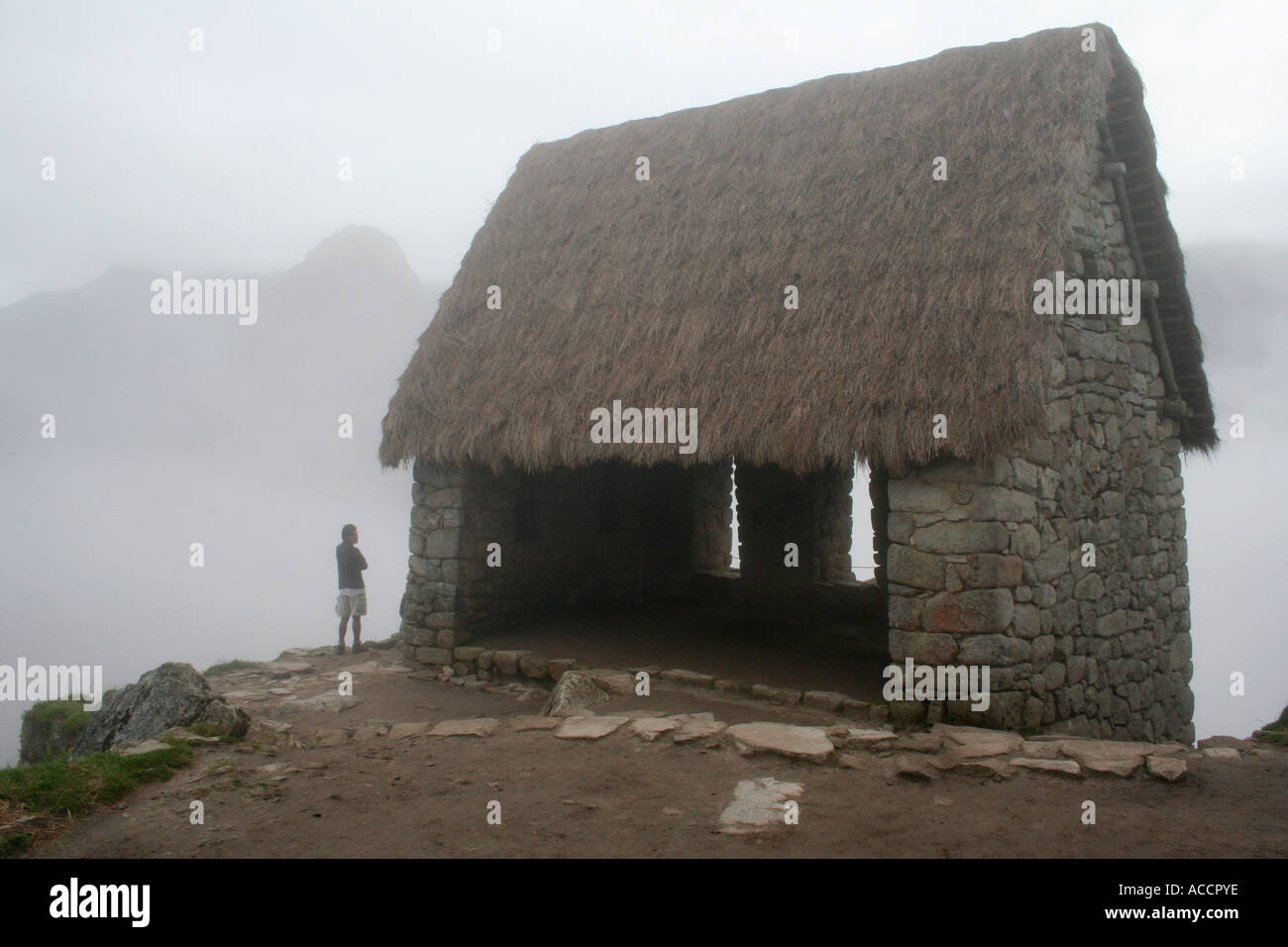 Watchman hut and tourist in fog, Machu Pichu, Peru Stock Photo - Alamy