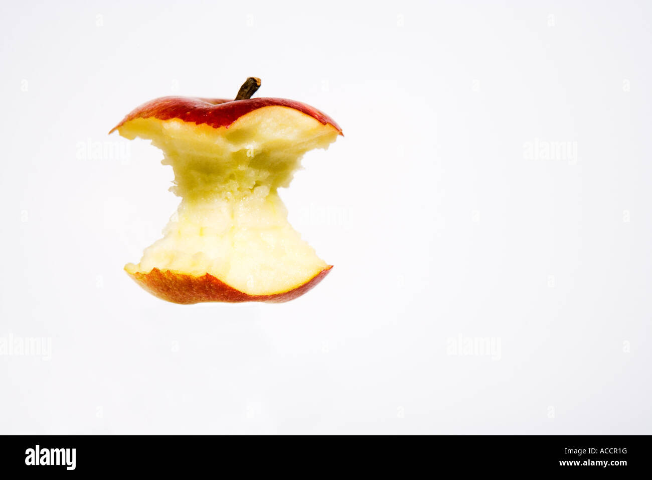 An apple core on a white background Stock Photo - Alamy