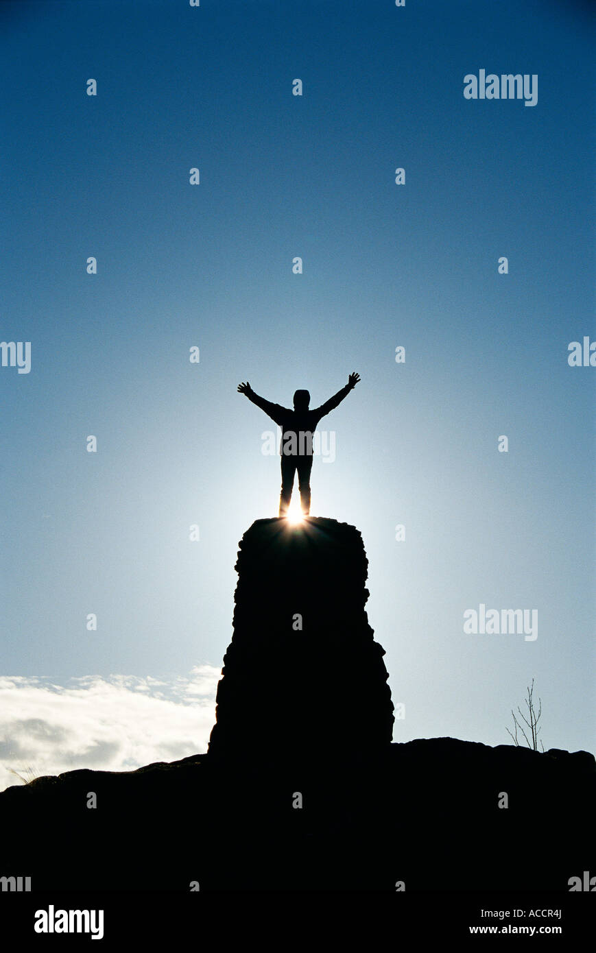 A person on a stone monument Stock Photo - Alamy