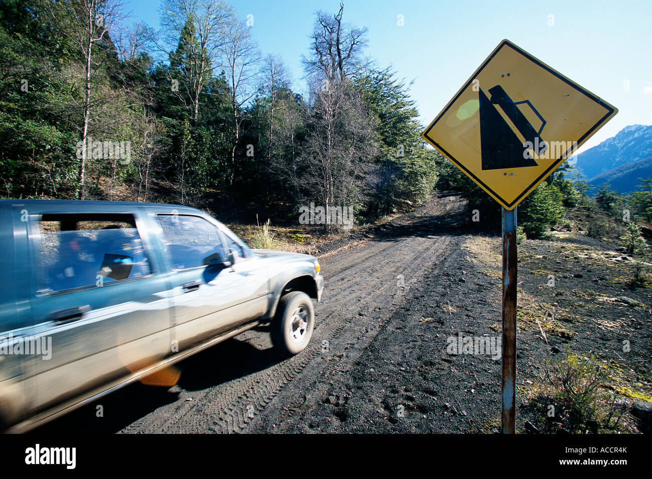 A traffic sign and a car on a road Stock Photo - Alamy
