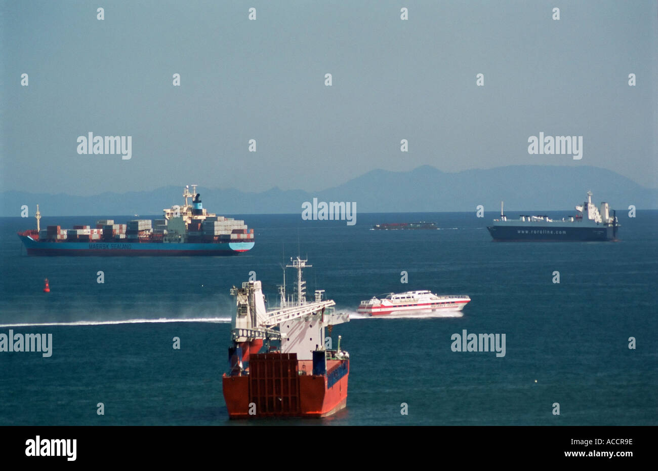 Ships in the harbour of Busan with the Japanese island of Tsushima in ...