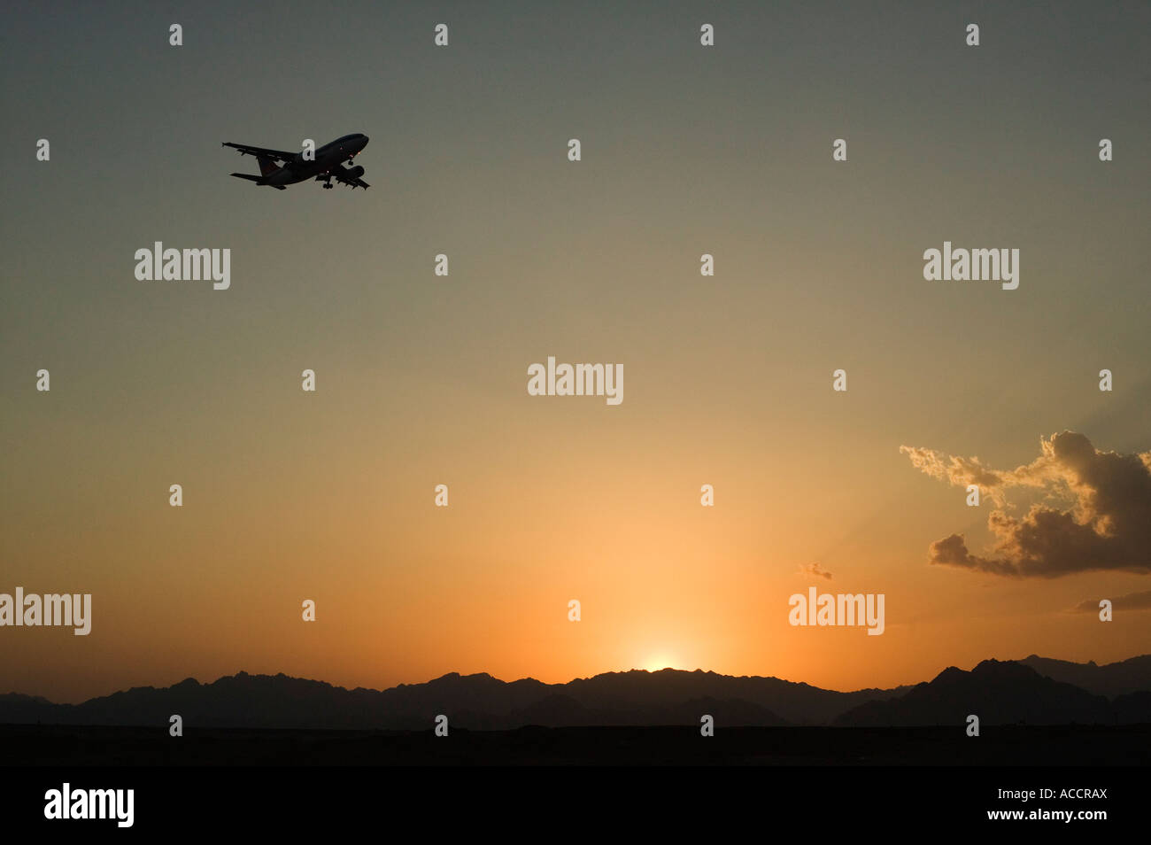 An airplane in sunset Stock Photo - Alamy