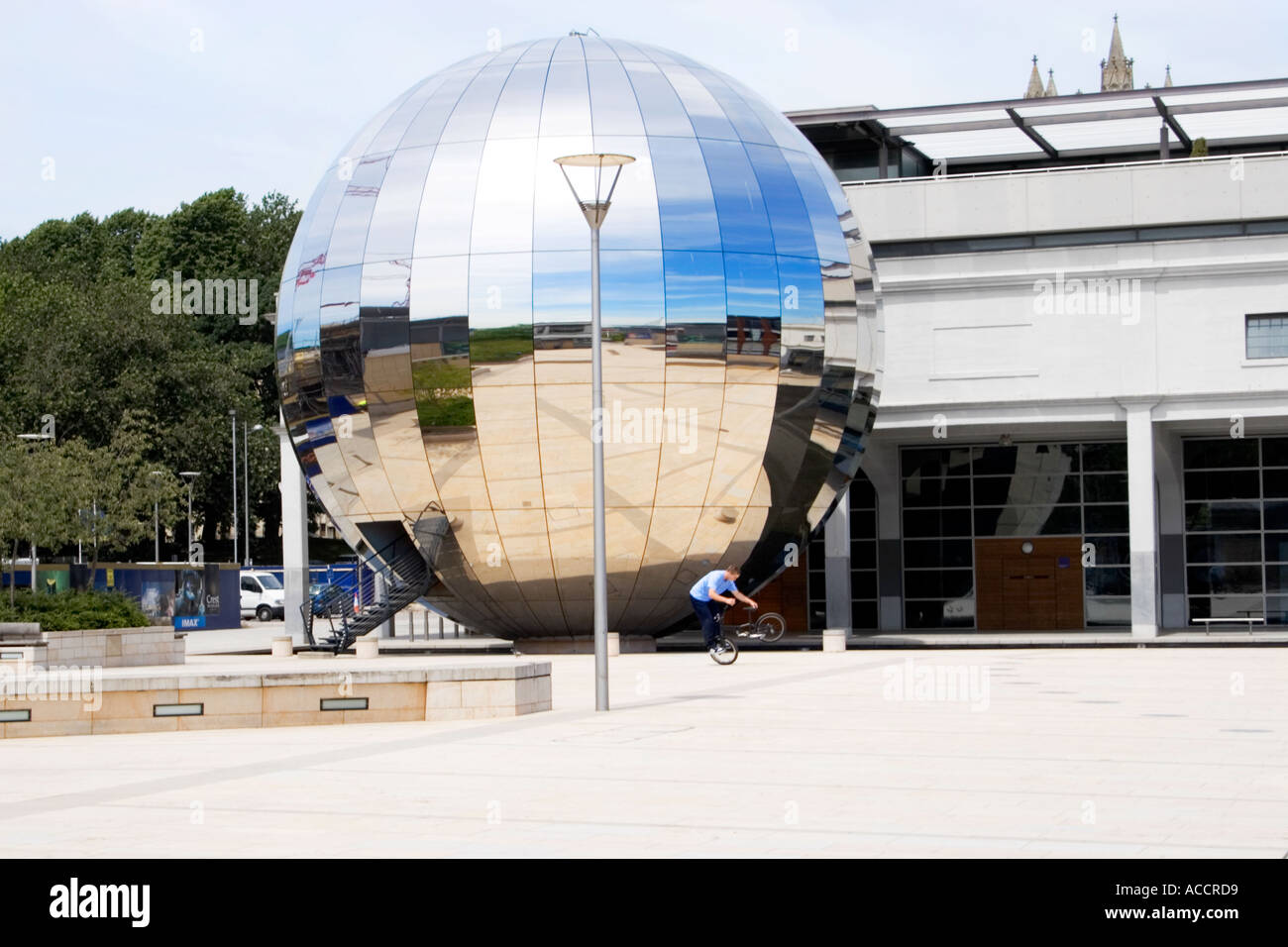 A boy doing bike stunts by The Bristol Imax theatre Stock Photo - Alamy