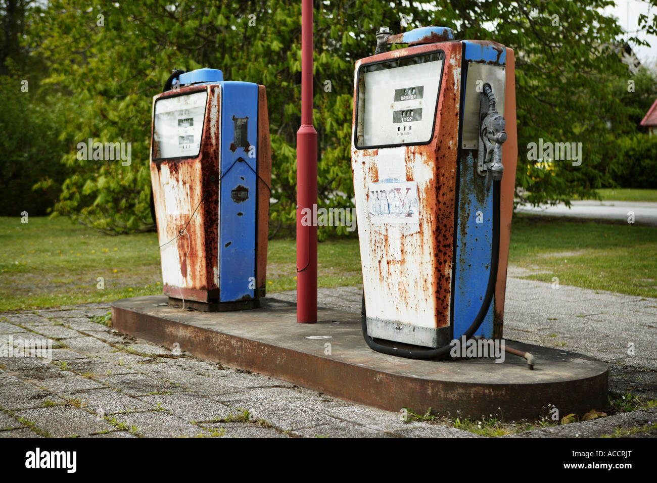 Rusty petrol pumps on a gas station Stock Photo - Alamy